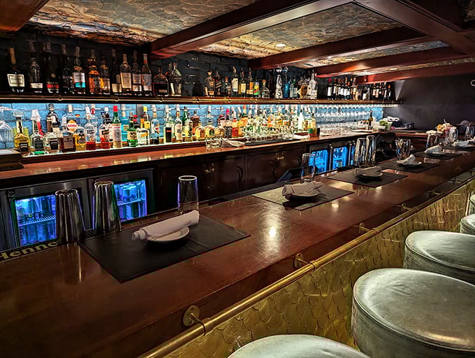 This isn't just a bar—it's a liquid library with illuminated shelves showcasing spirits from around the world, ready for your research.