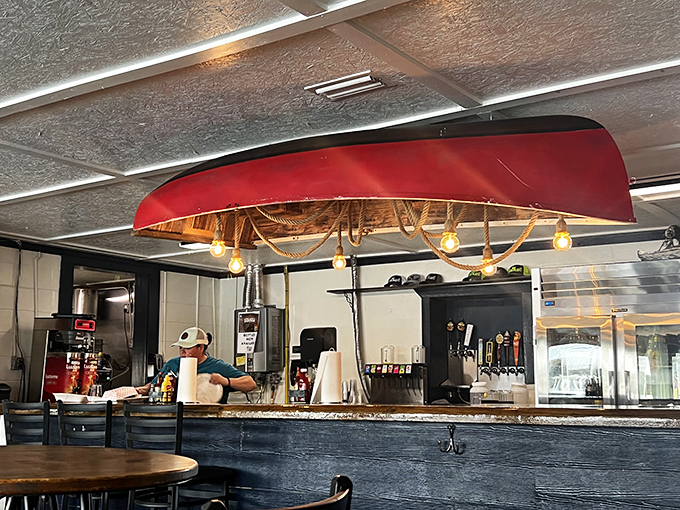 The heart of hydration operations, crowned with a canoe. This bar doesn't need fancy mixologists—just cold drinks for hot crab enthusiasts.