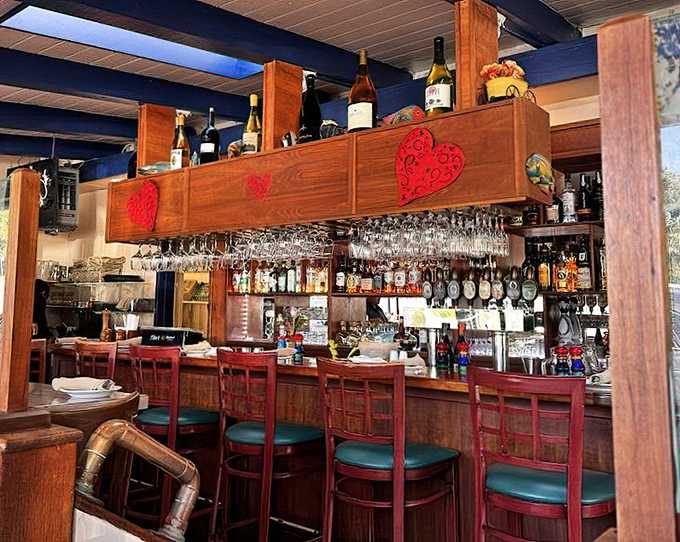 The bar – where liquid courage is dispensed before you try your first raw oyster. Those heart decorations aren't just for show.