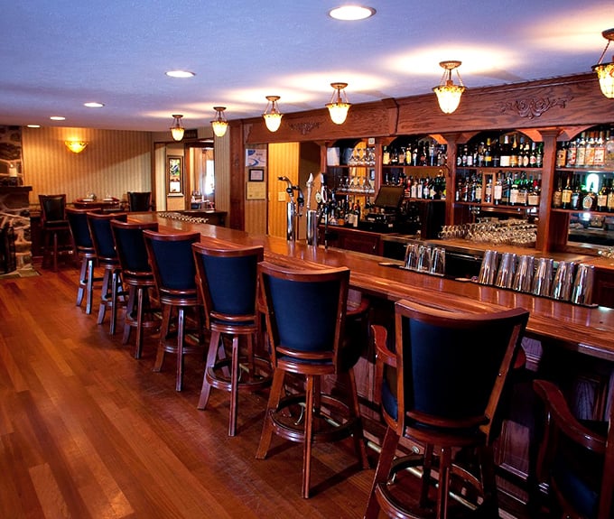 The bar isn't just serving drinks; it's offering liquid happiness in a room that feels like a warm hug.