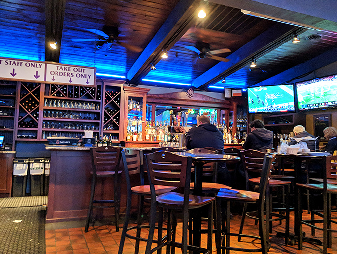 The bar's blue lighting sets a mood that says "stay for one more slice" – and who are we to argue?