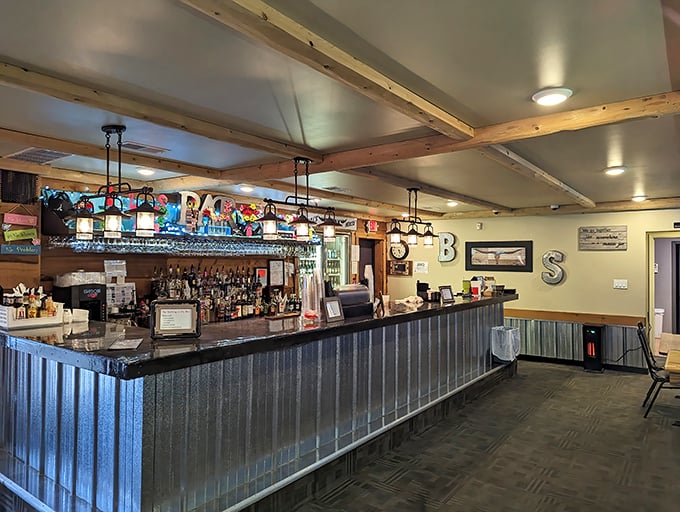 The bar area gleams with promise, its corrugated metal front and wooden top ready for elbows and stories. "BS" indeed stands for "Best Steaks."