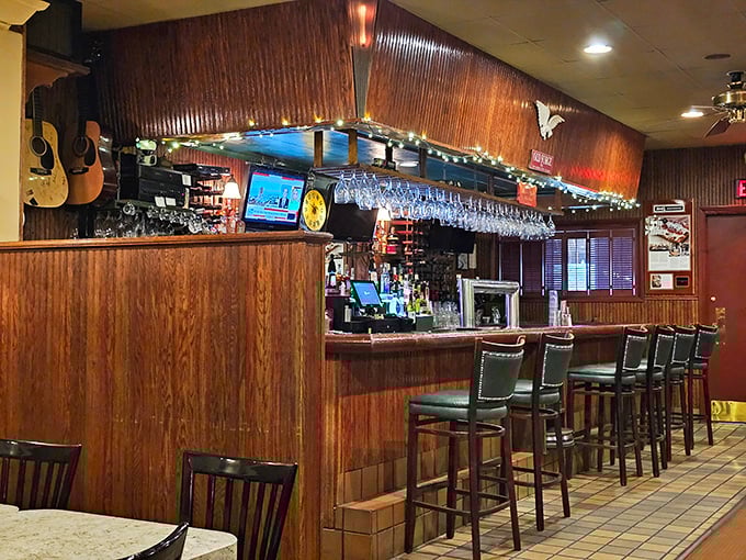 The bar area: where strangers become friends and regulars are treated like royalty. Notice the guitars—music and good food always belong together.