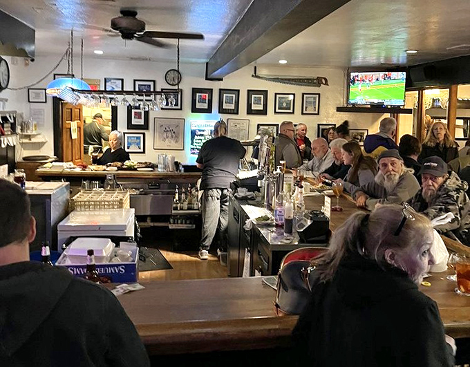 The bar area—where sports on TV meet stories told over cold drinks. A neighborhood gathering spot where "just one more" is the most common phrase.