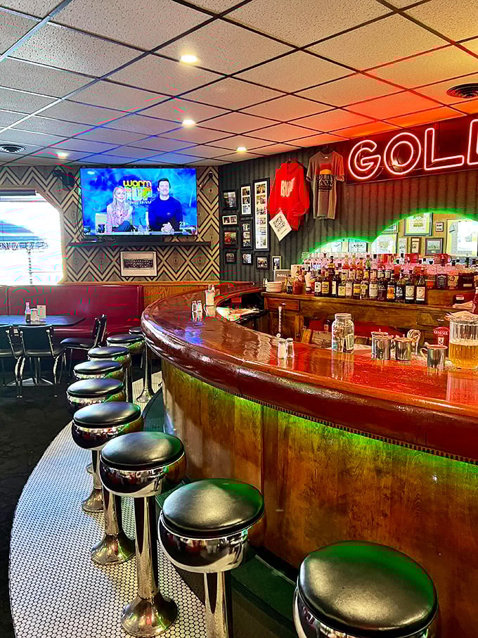 A bar that's seen it all, with stools that have supported generations of Ohioans. The wood gleams with stories and bourbon spills.