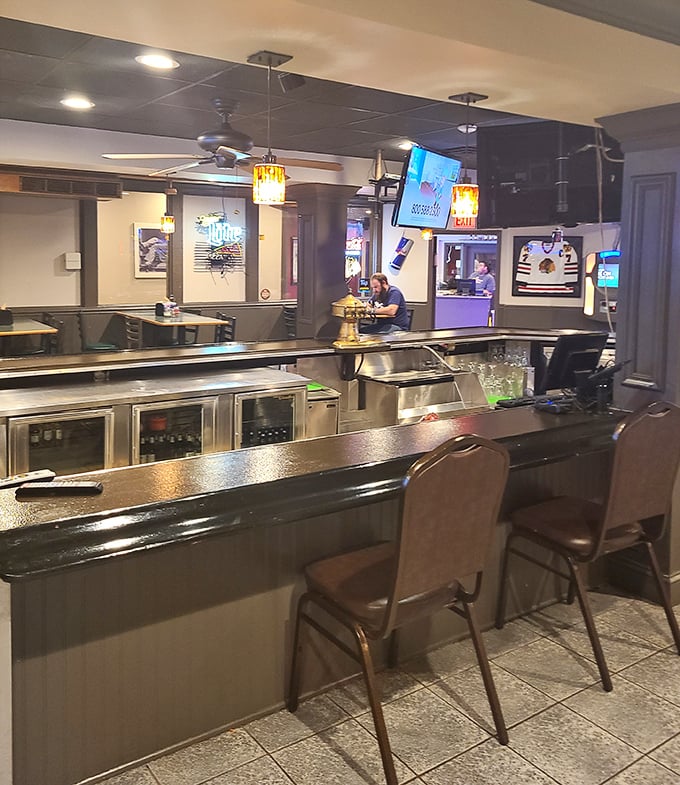 The bar area offers a front-row seat to the game and a direct line to refreshments—strategic positioning at its finest.