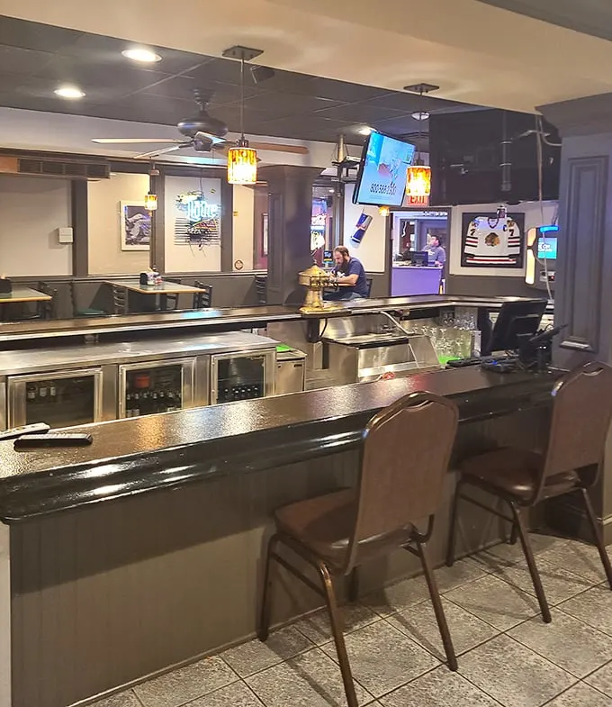 The bar area offers a front-row seat to the game and a direct line to refreshments—strategic positioning at its finest.