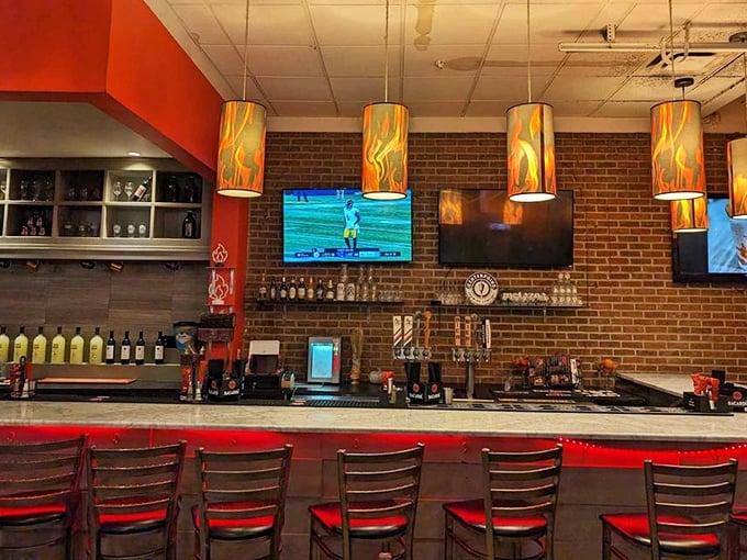The bar area glows with pendant lights that look like flames—subtle foreshadowing for the flavor explosions about to happen.
