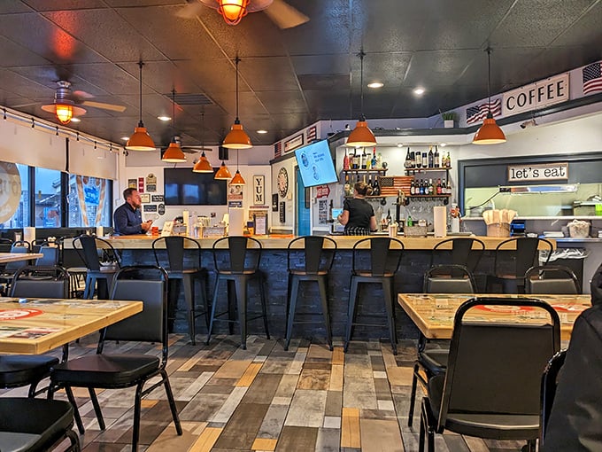 The bar area combines diner charm with neighborhood hangout energy. Those orange pendant lights have witnessed countless Florida stories unfold.