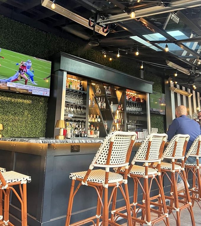 The bar area blends modern sports-watching convenience with bistro-style seating, proving that catching the game doesn't require sacrificing culinary standards.