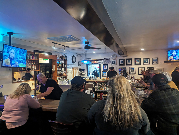 The bar area combines old-school charm with modern conveniences for the perfect dining experience.
