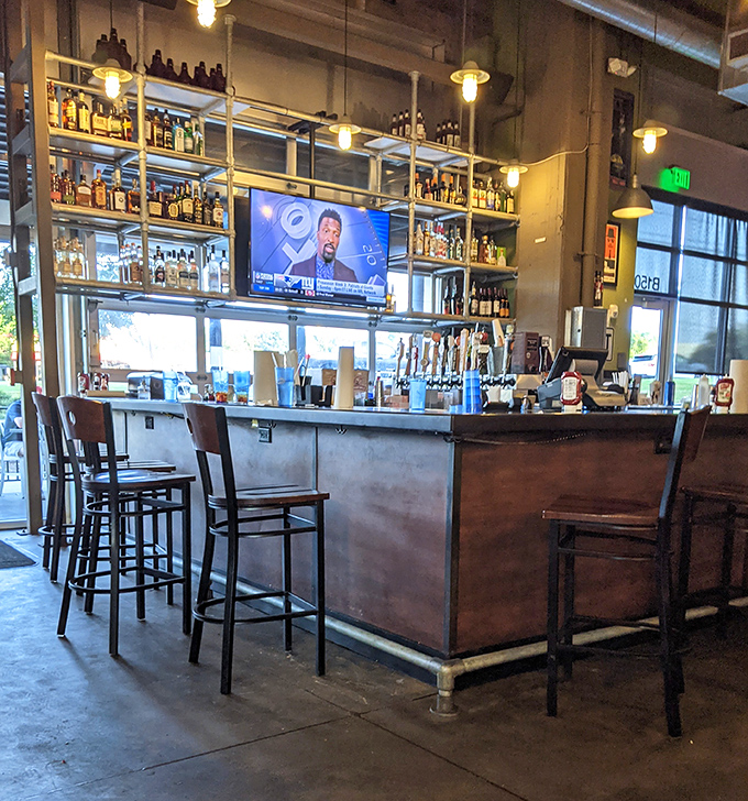 The bar's industrial-meets-rustic vibe offers front-row seats to craft beer heaven—where burger pairings are serious business.