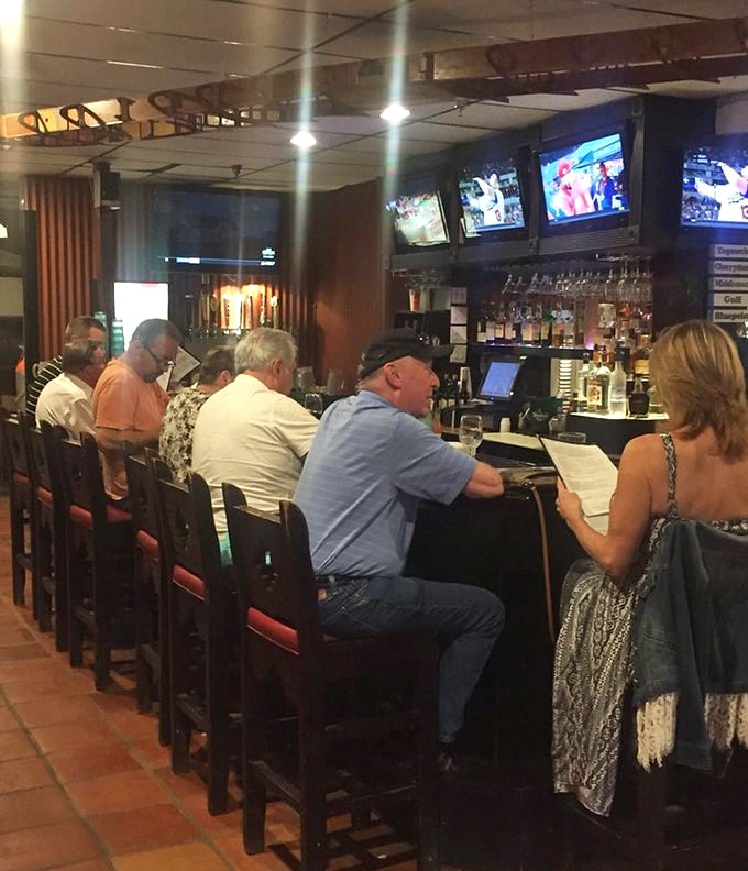 The bar area—where strangers become friends and friends become regulars over cold drinks and hot seafood tips.