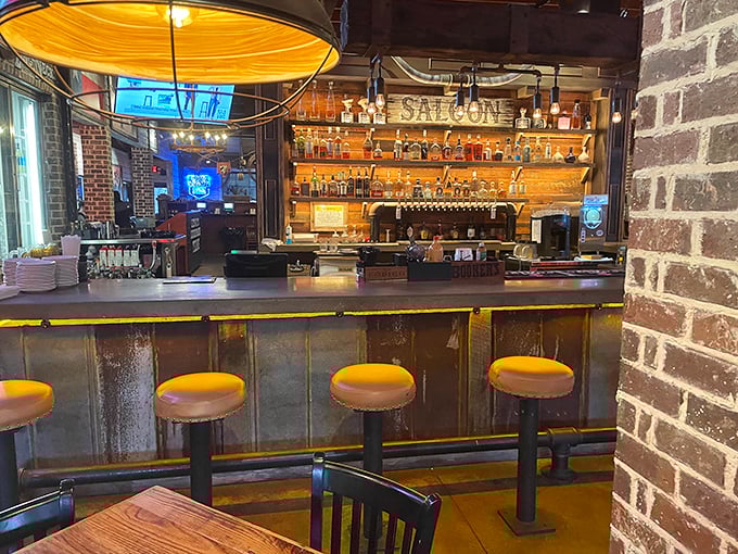 The bar area beckons with its "Texas Saloon" sign and impressive spirits collection—a watering hole where bourbon and beef are equally revered.