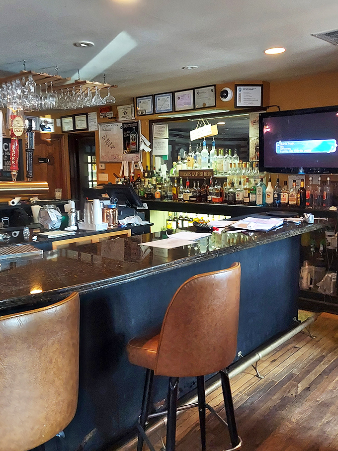 A bar that understands its purpose: good drinks served without pretension. Those certificates on the wall? They're not for show—they're earned.