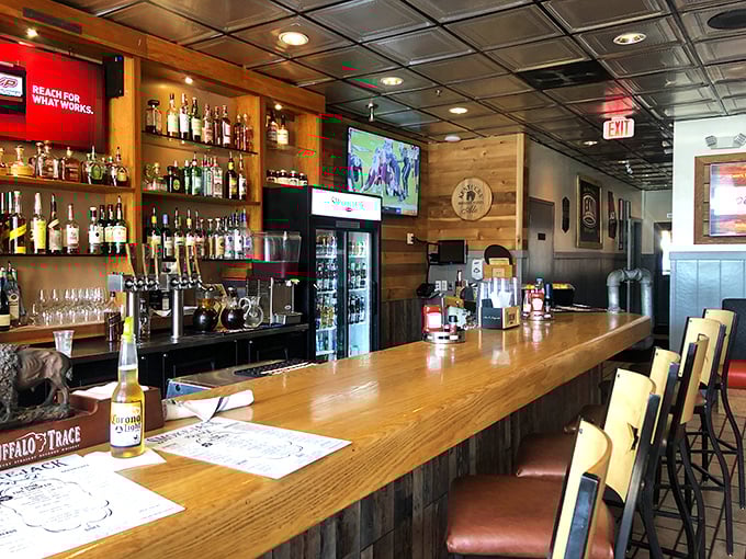 A bar stocked with enough bourbon to make Kentucky nervous, ready to complement your smoked meat adventure with liquid courage.