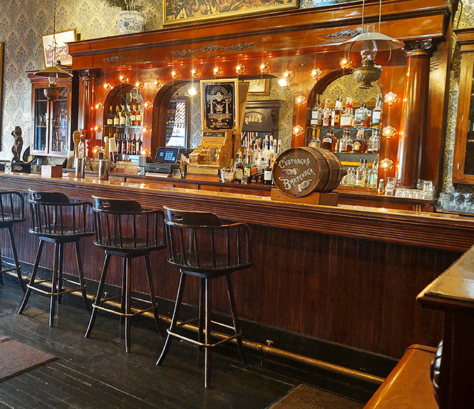 The bar gleams with the polished patina of countless elbows and stories, a watering hole where strangers become friends over whiskey.