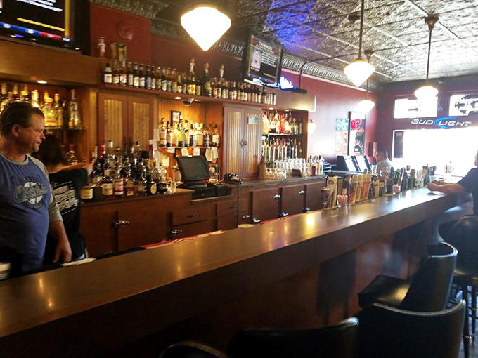 A bar that means business – with an impressive lineup of spirits, ornate ceiling tiles, and the promise of perfectly crafted drinks to accompany your meal.
