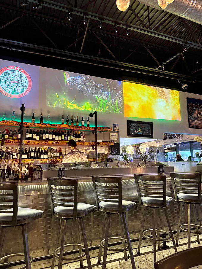 The bar area glows with possibility—and enough bottles to ensure your seafood feast comes with the perfect liquid companion.