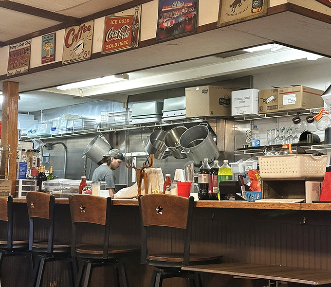 The heart of any great diner is its kitchen—where magic happens on well-seasoned grills under the watchful eyes of vintage signs.