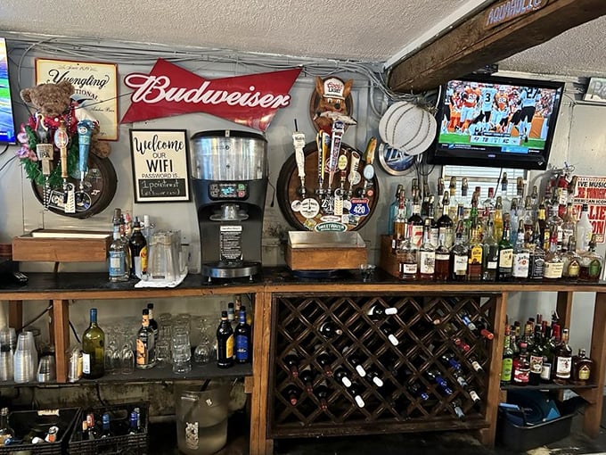 The bar at The Point isn't trying to be trendy—it's the kind of place where Budweiser signs and fishing memorabilia tell the real story.