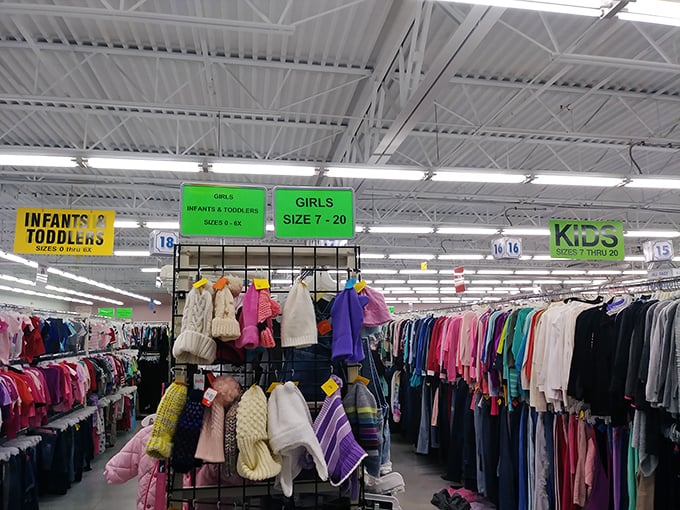 The children's section, organized with military precision, where growing kids can get outfitted without growing your credit card bill.