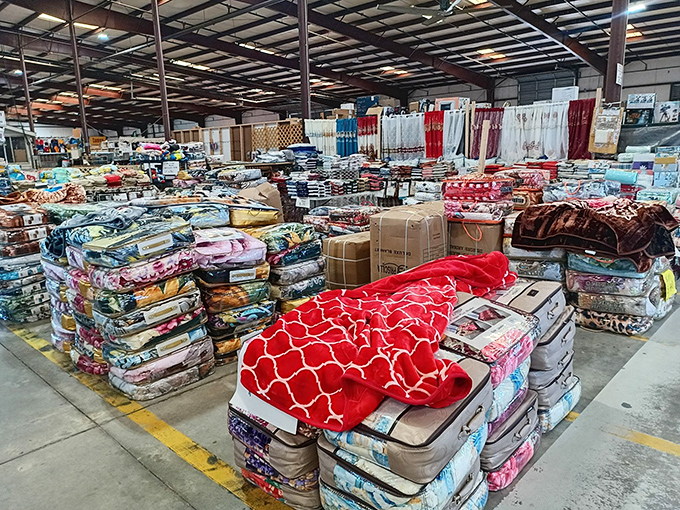 Bedding stacked to the heavens – a textile mountain range of comfort possibilities. Pillow-top dreams at basement-bargain prices.