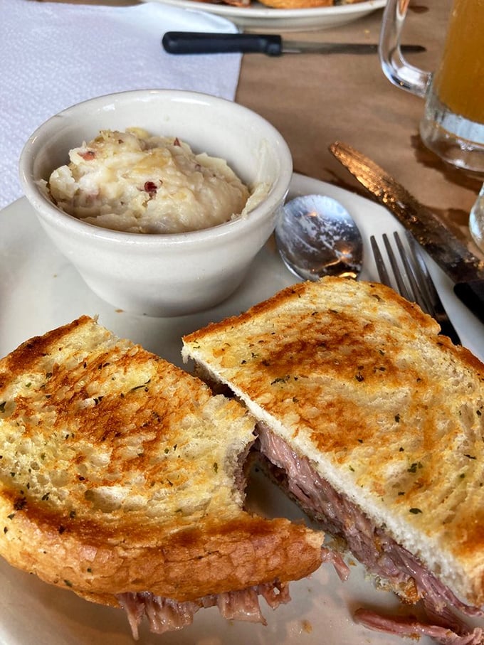 This sandwich isn't just lunch—it's architecture. Layers of smoky brisket between buttery toast with creamy mashed potatoes standing guard.