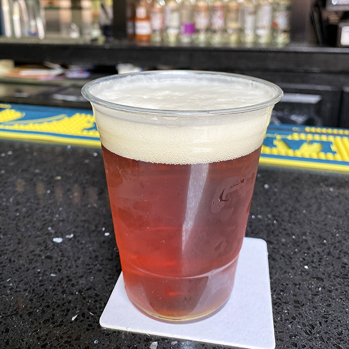 A golden pint sporting the Barnaby's logo—because sometimes your thirst can only be quenched by something cold, hoppy, and local.