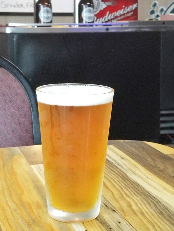 A perfectly poured beer with just the right amount of head—like liquid gold in a glass, waiting to wash down all that glorious food.