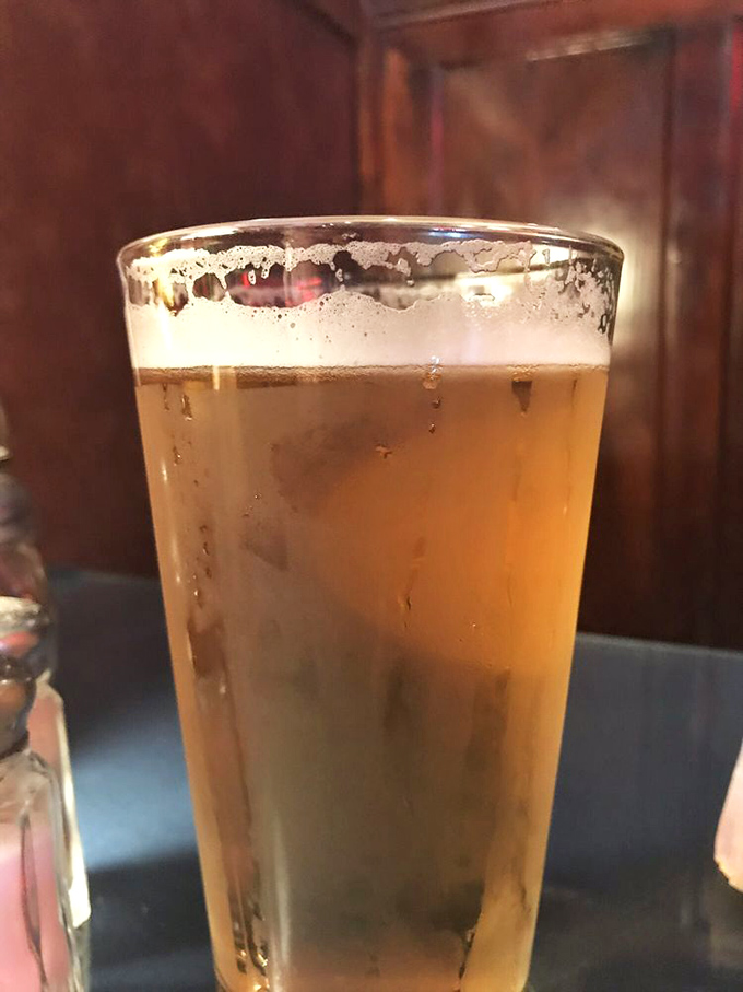 A perfectly poured beer with that satisfying foam collar—proof that simple pleasures are often the most reliable companions.