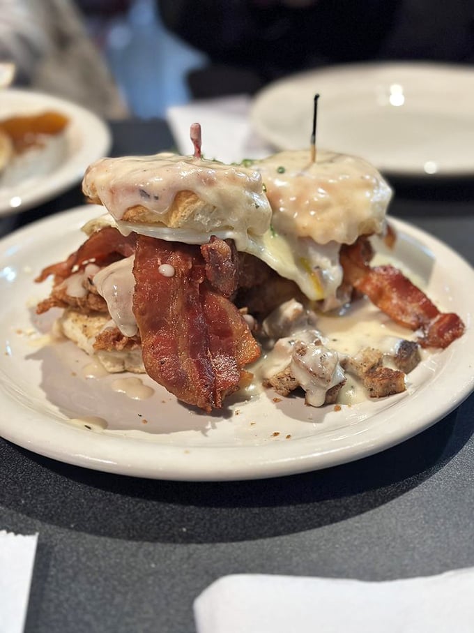 This isn't just breakfast—it's architecture. Layers of biscuit, bacon, and gravy creating the Taj Mahal of morning indulgence.