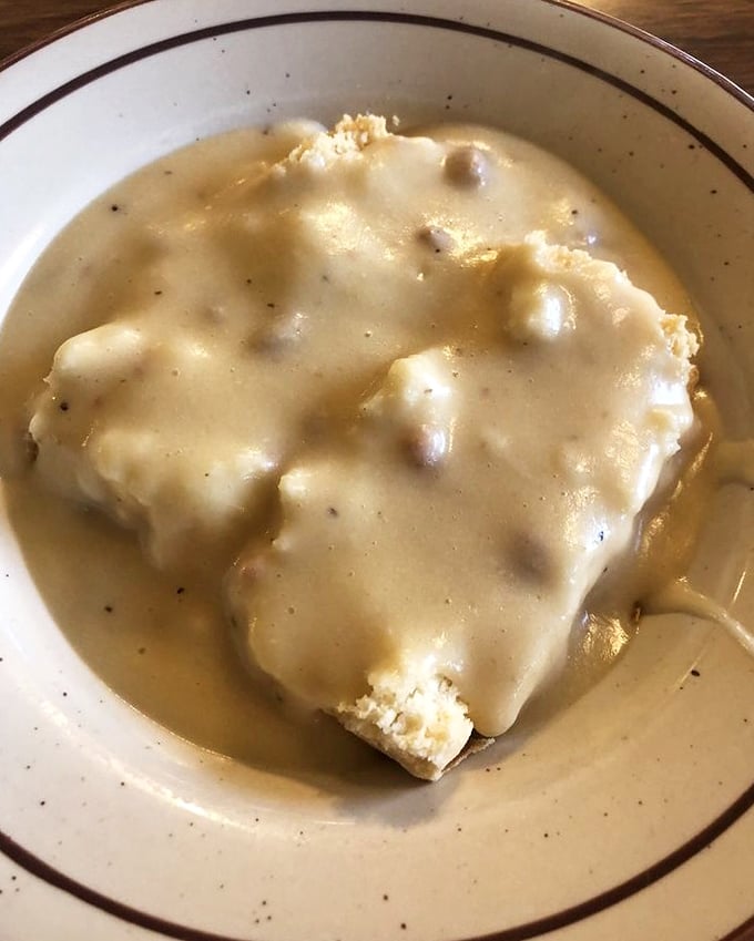 Biscuits drowning happily in peppery sausage gravy—a Southern classic that found its way west and decided to stay. Comfort food that speaks in whispers.