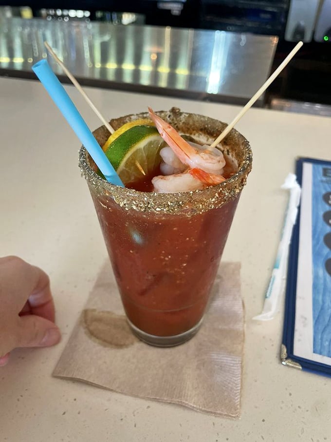 The ultimate Bloody Mary—where tomato juice meets the sea in a glass rimmed with enough spice to wake up your taste buds and your weekend.