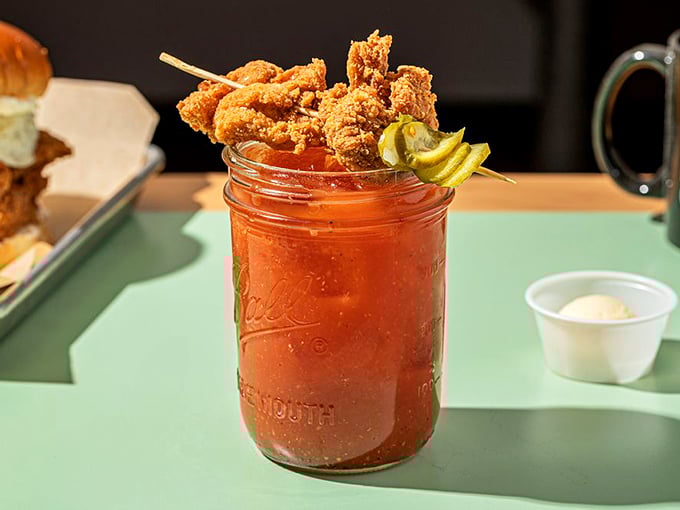 The Bloody Mary that eats like a meal. Topped with crispy chicken, it's breakfast, lunch, and cocktail hour rolled into one glorious mason jar.