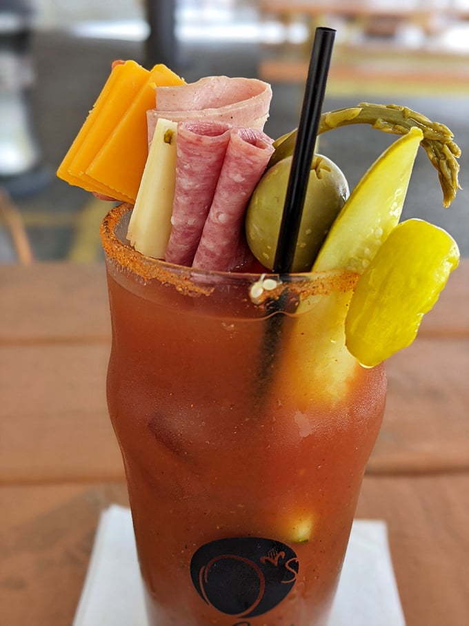 This Bloody Mary isn't just a drink – it's a meal, a conversation piece, and possibly the eighth wonder of the world. The garnish game is strong with this one.