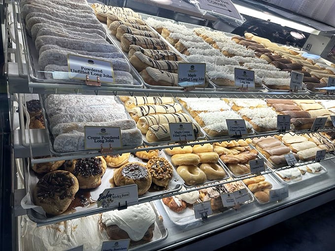 This bakery case is Pennsylvania Dutch heaven—where powdered sugar snowdrifts cover pastries that would make your grandmother weep with pride.