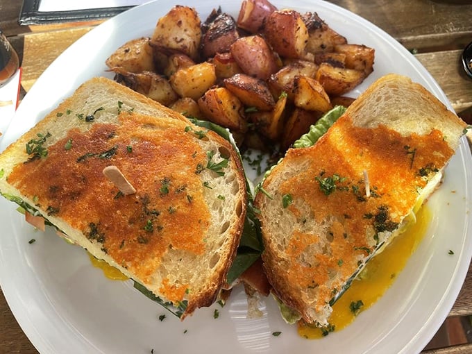 This sandwich isn't just breakfast, it's an architectural achievement—layers of flavor held together by perfectly toasted bread and hope.