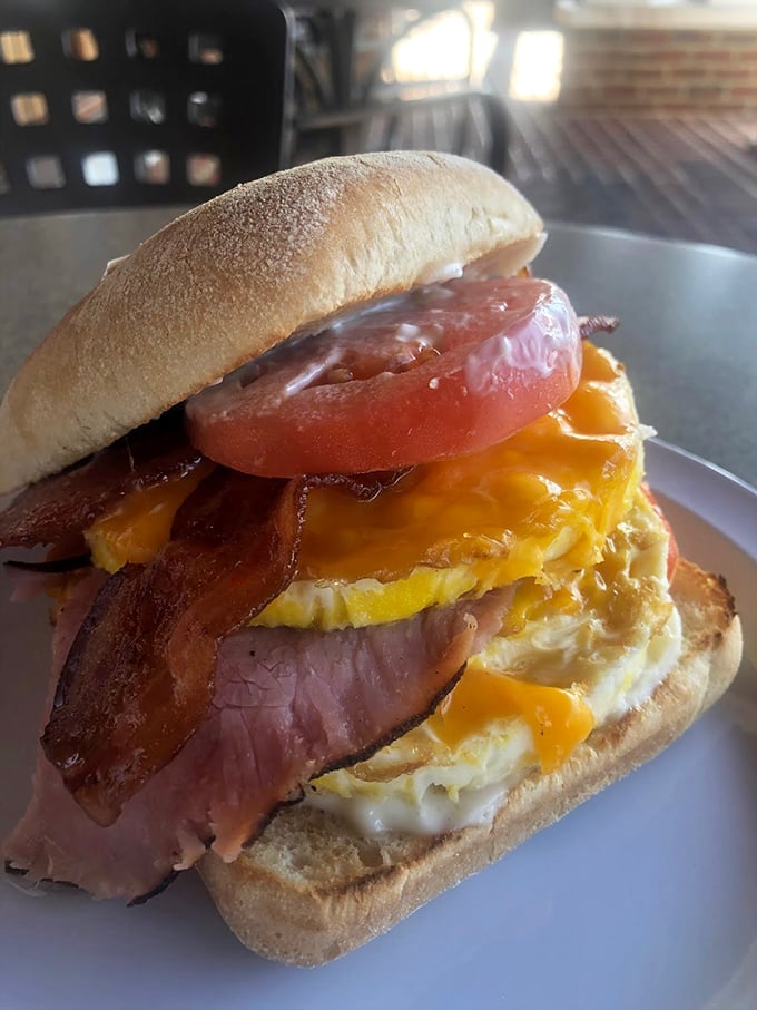 The breakfast sandwich that launched a thousand road trips—ham, egg, and cheese stacked so perfectly it deserves its own architectural award.