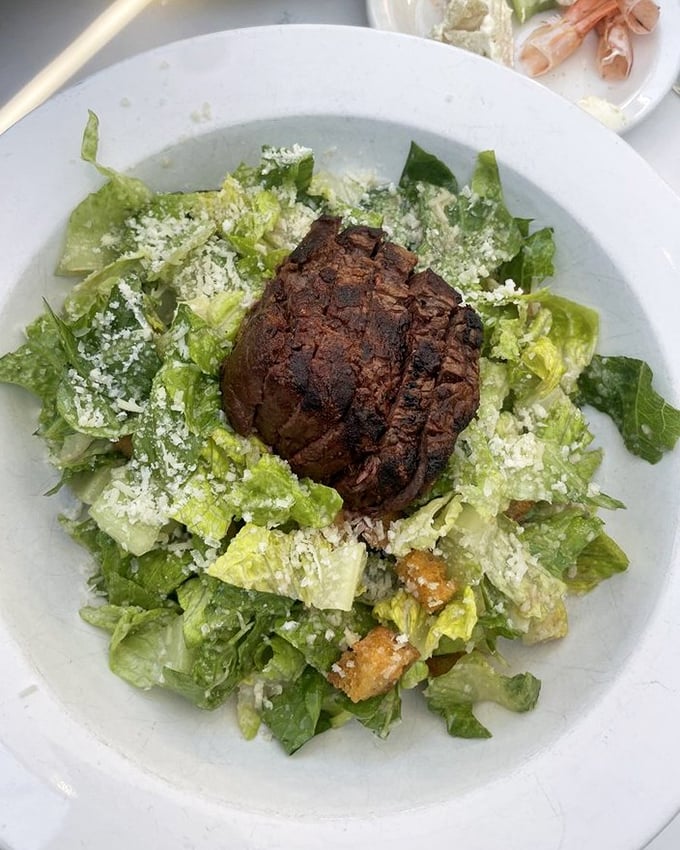 A Caesar salad crowned with a perfectly charred filet. When your salad gets a promotion to main course, this is what it looks like.