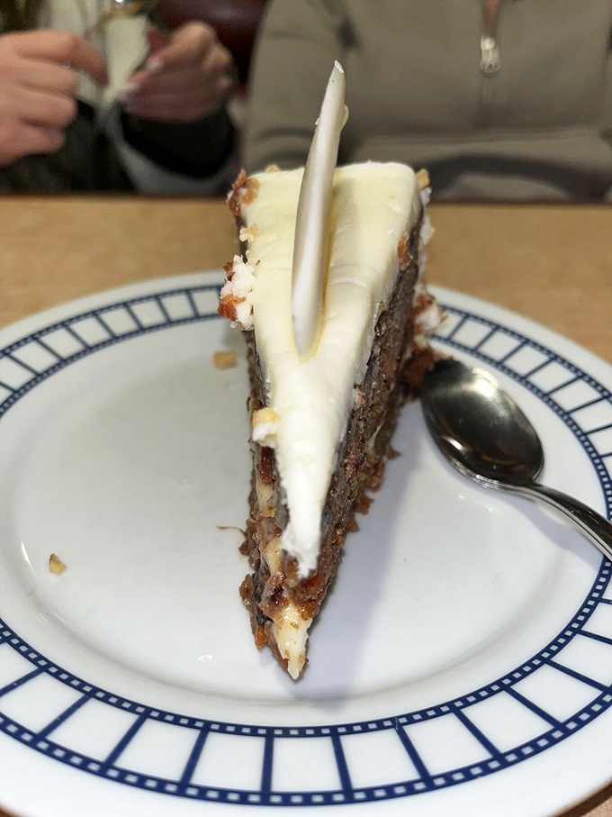 Carrot cake that would make even non-dessert people reconsider their life choices—cream cheese frosting so perfect it deserves its own spin-off show.