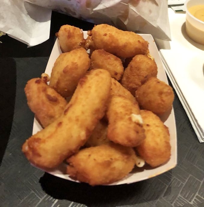 These cheese curds have achieved the impossible: a crust that audibly shatters while protecting a center that stretches for days.