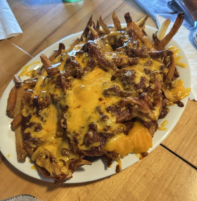 Chili cheese fries that don't mess around. That molten cheese blanket isn't just for show—it's insulating a treasure trove of perfectly crispy potatoes below.