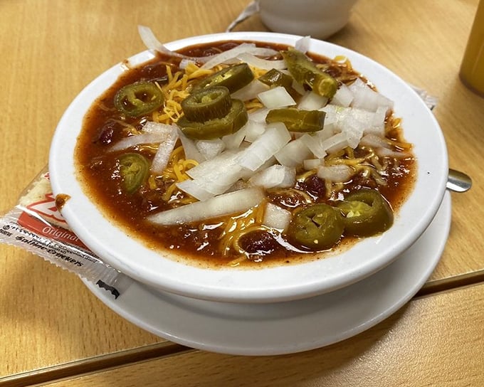 Chili that's worth the sweat! Topped with jalapeños, cheese, and onions, this bowl brings the heat and the heart.