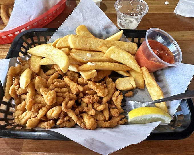 The perfect marriage of golden-fried clam strips and crispy fries. That little cup of sauce is about to become your new best friend.