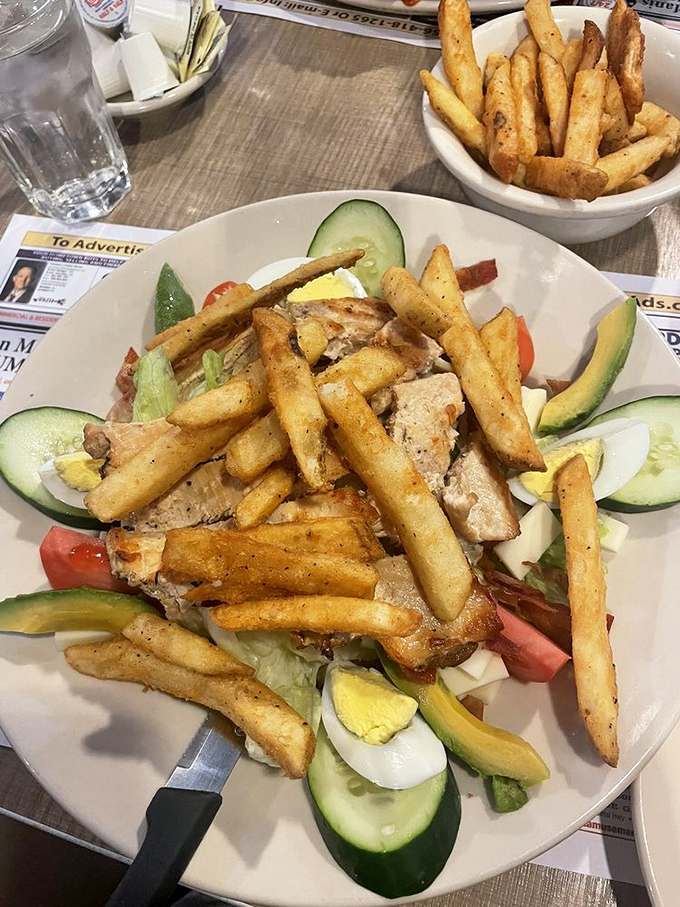 A salad substantial enough to satisfy even the most committed carnivore. Those fries aren't garnish—they're an essential food group.