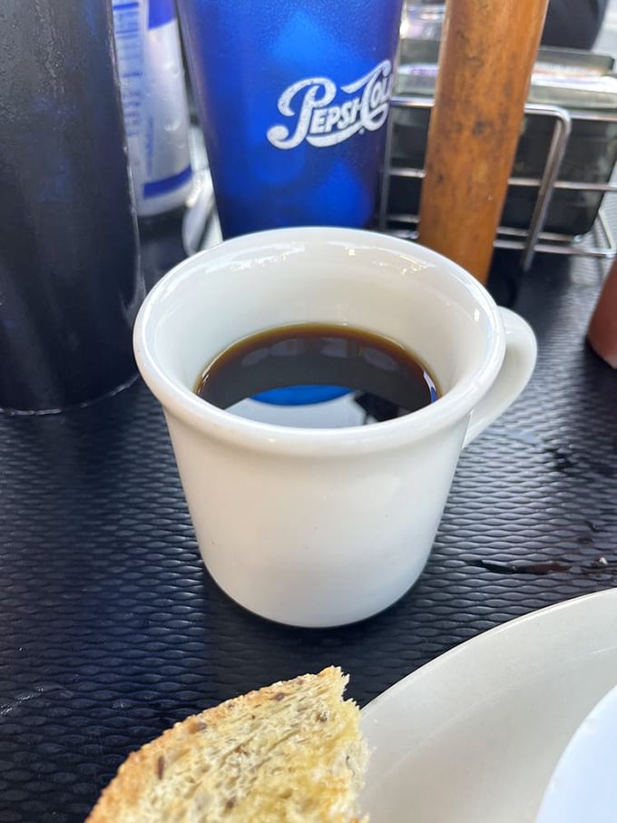 Simple diner coffee in a sturdy white mug—the kind that keeps getting refilled without you having to ask. Life's small pleasures.