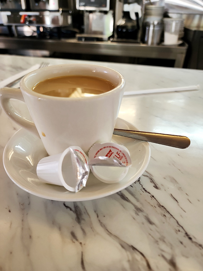 Classic diner coffee served in proper cups and saucers – because some traditions are too perfect to mess with.