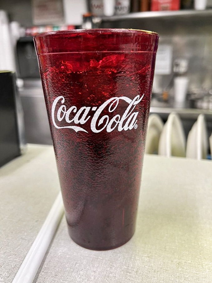 That classic Coca-Cola in a frosty glass—somehow it always tastes better in places where burgers are taken seriously.