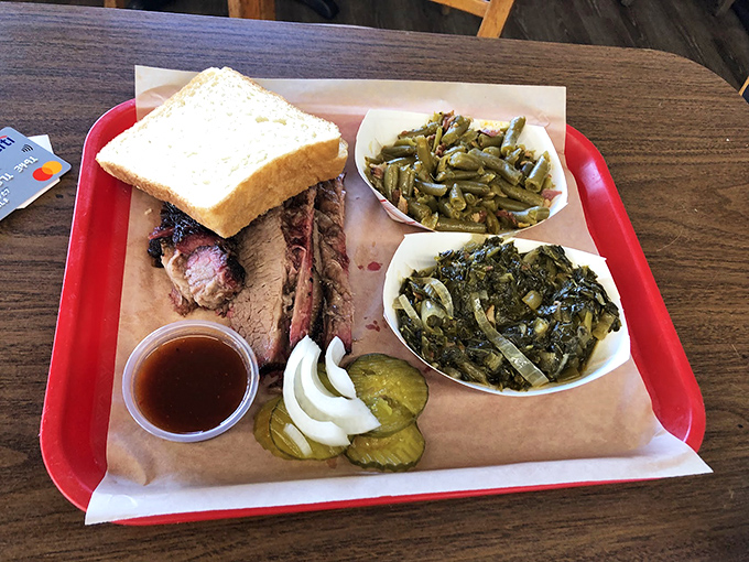 A tray that tells the complete Texas story—meat, bread, pickles, onions, and greens. The state flag in edible form.